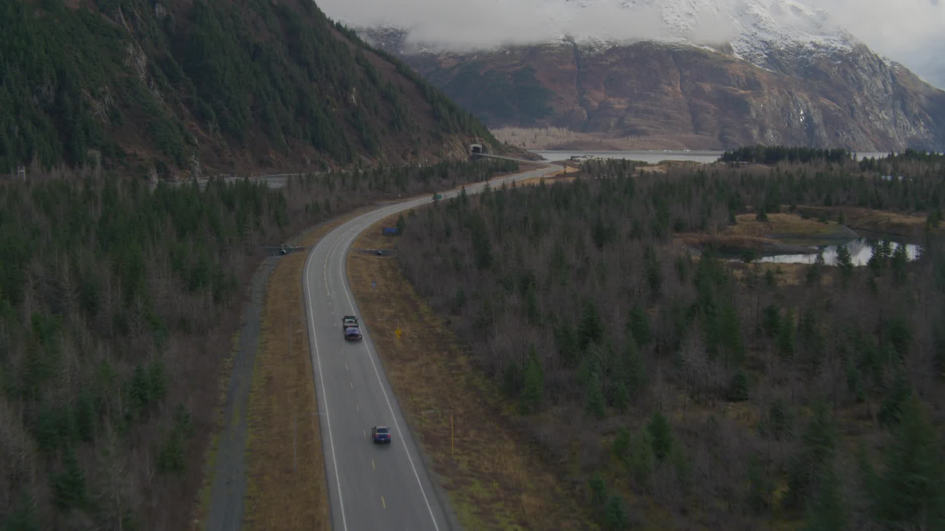 4K stock footage aerial video truck on Portage Glacier Highway, tunnel ...