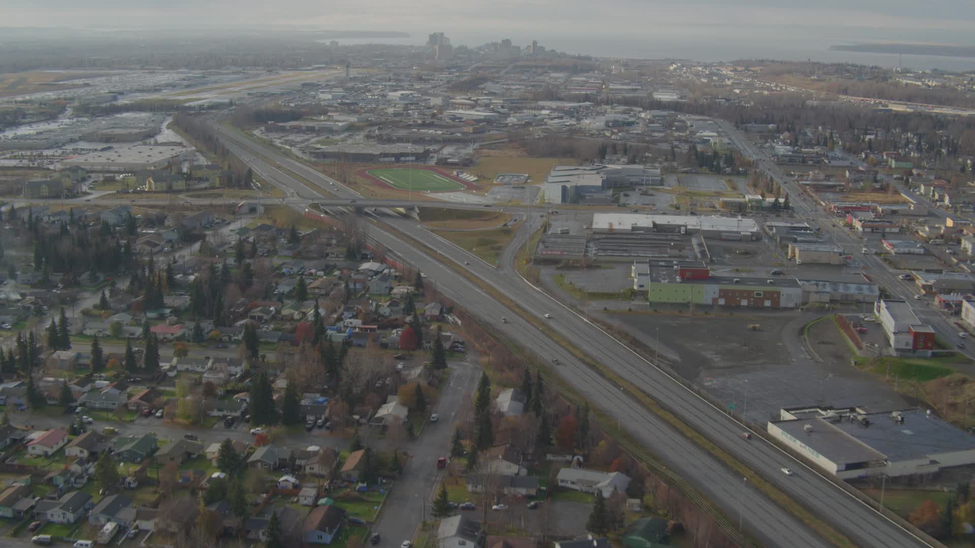 4K stock footage aerial video following Glenn Highway, approach Merrill ...