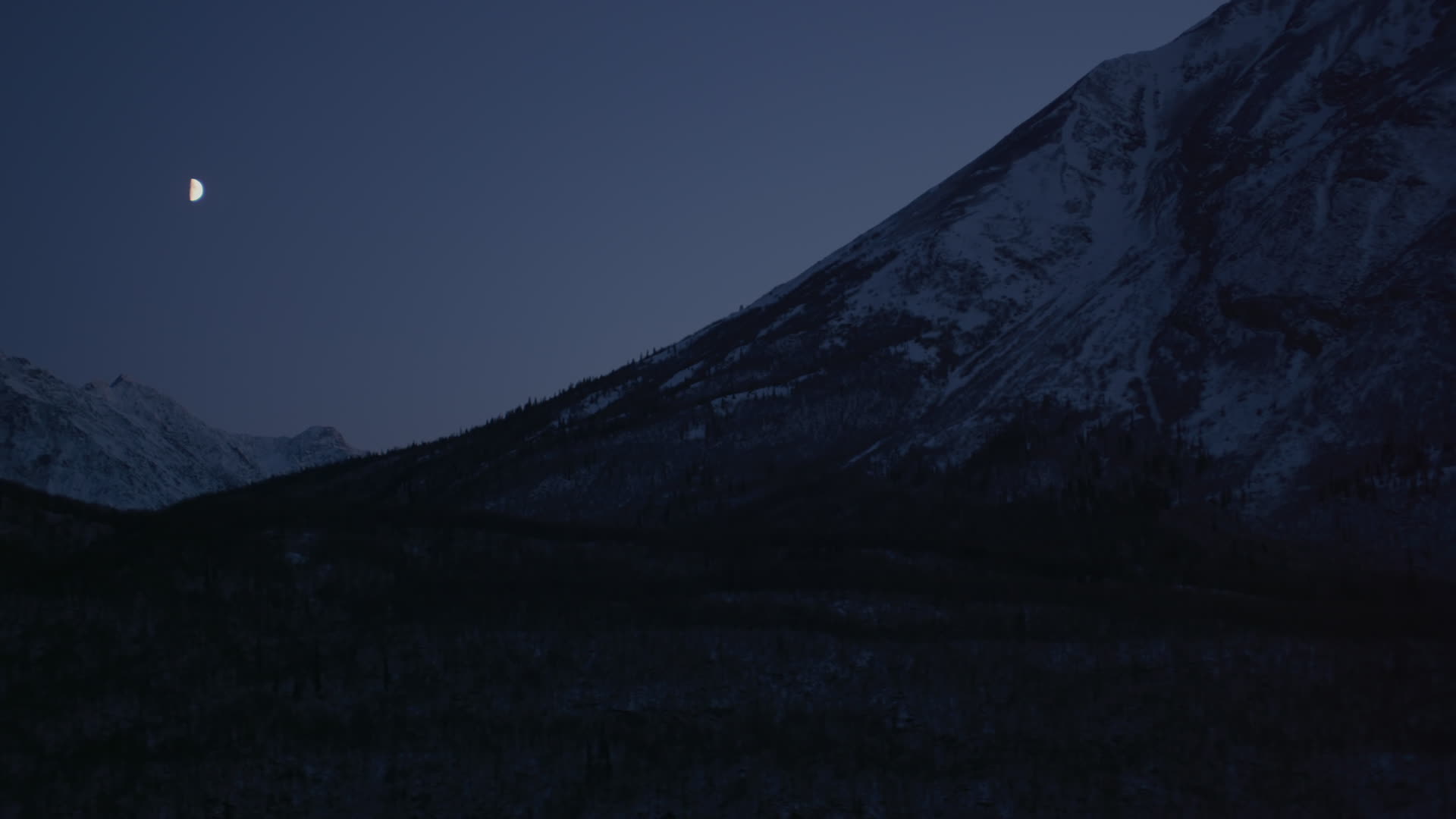 4K stock footage aerial video the moon over the snow covered Chugach ...