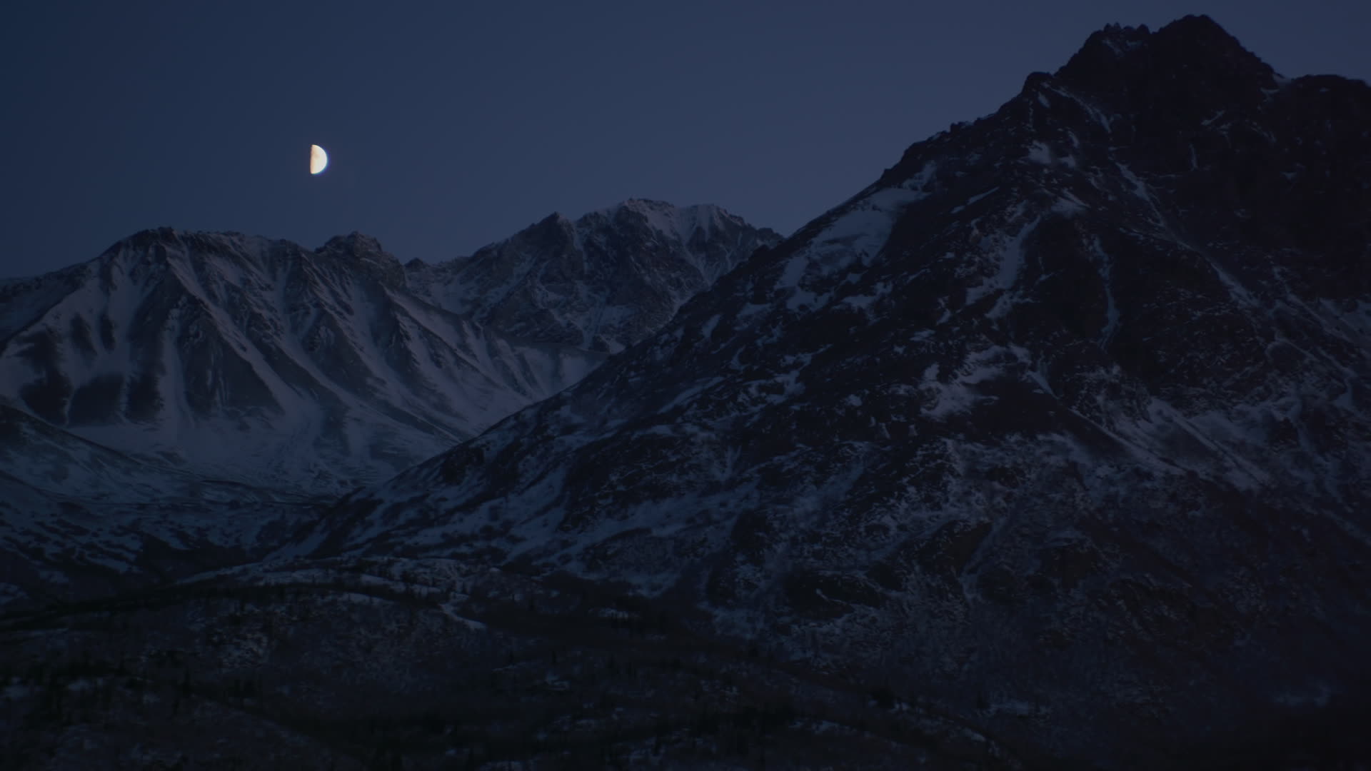 4K stock footage aerial video the moon over the snow covered Chugach ...