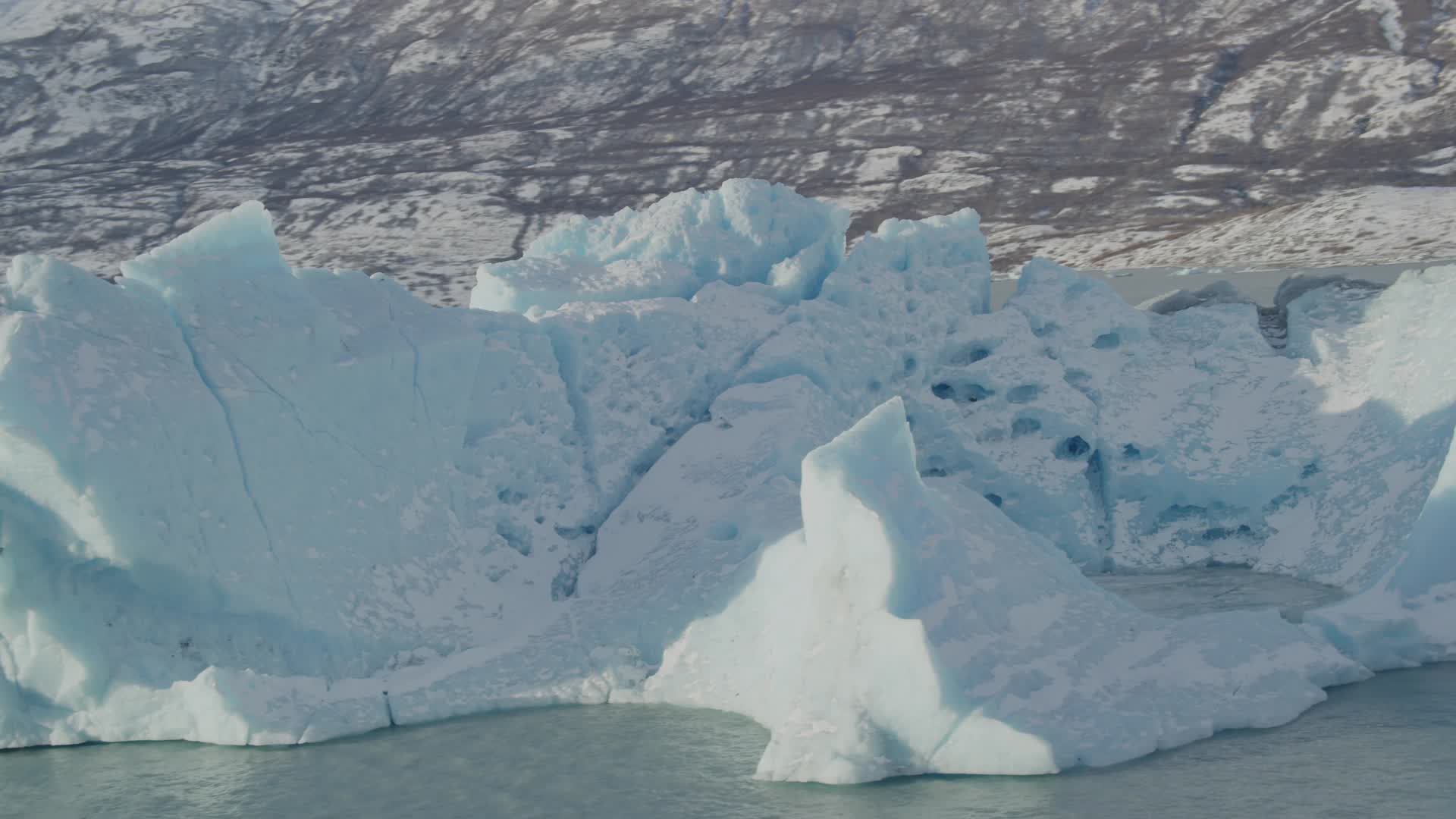4K stock footage aerial video orbiting a chunk of glacial ice in Inner ...