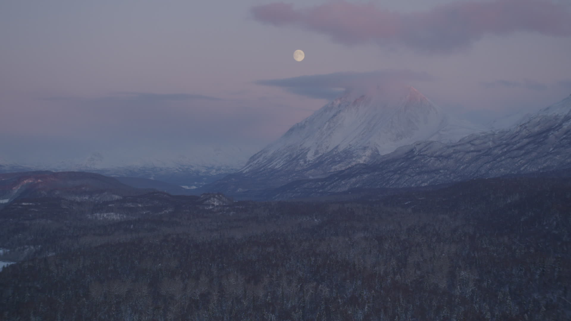 4K stock footage aerial video the moon over the snow covered Chugach ...