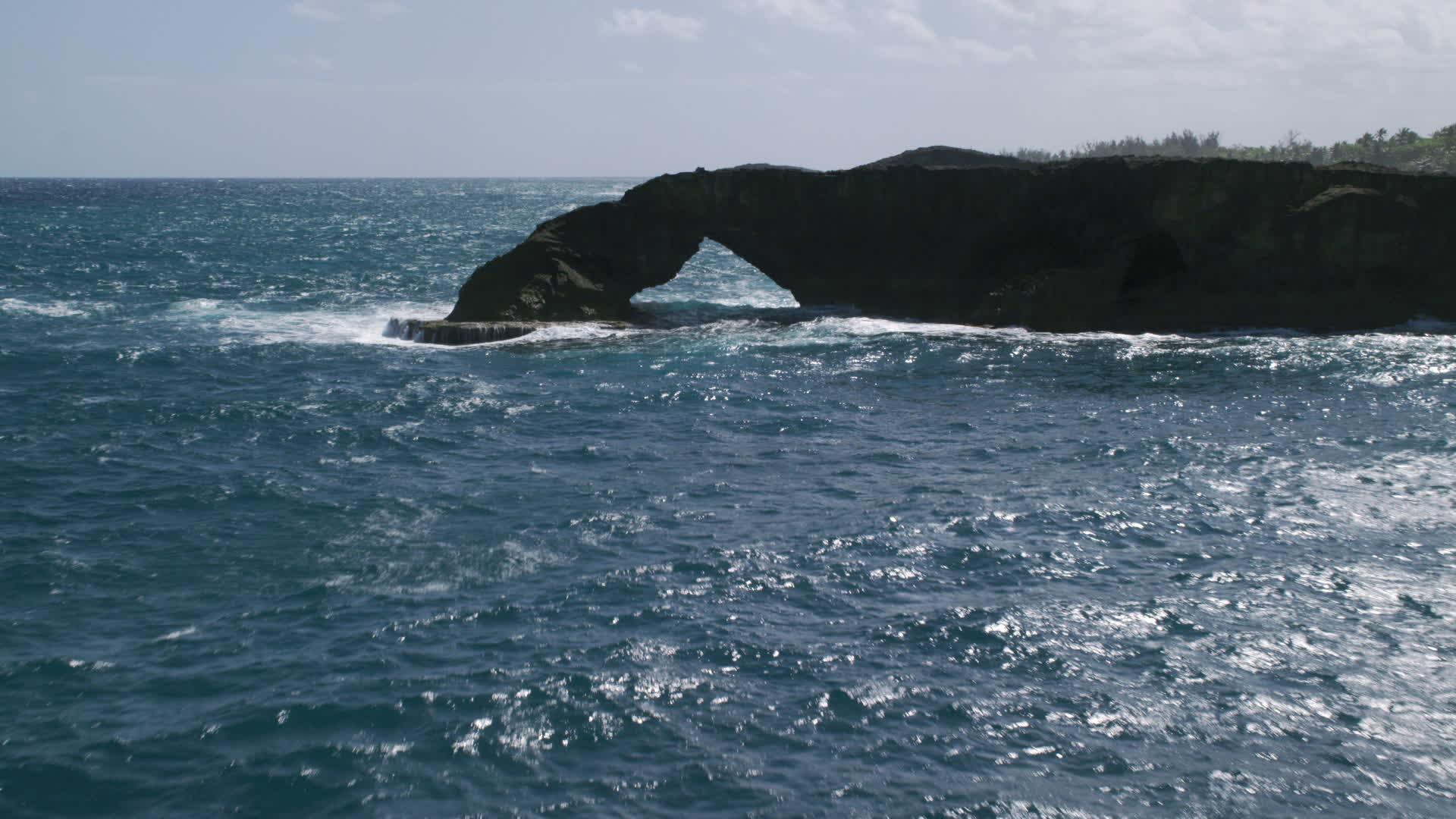 4.8K stock footage aerial video of an Arched rock formation in crystal ...